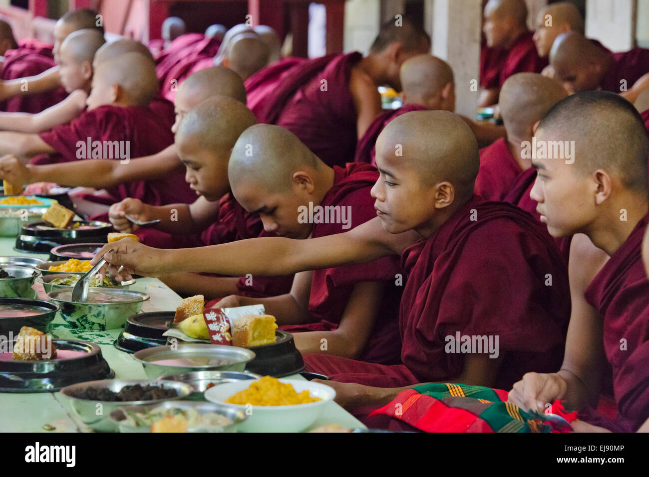 Monks eating a meal at Mahagandayon Monastery, Amarapura, Manadalay ...