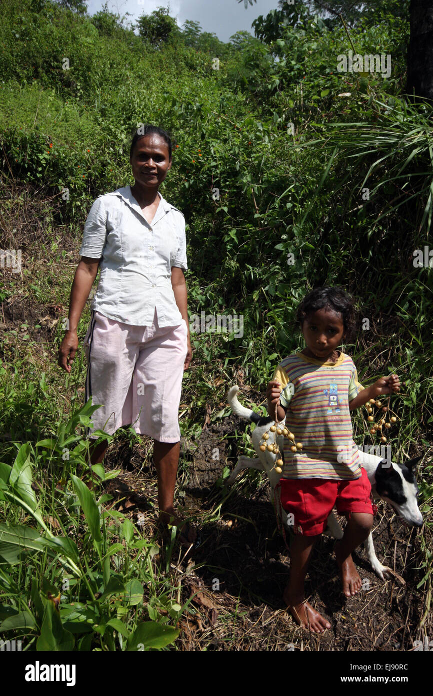 Woman, child and dog on a walk near Same, capital of Manufahi ...