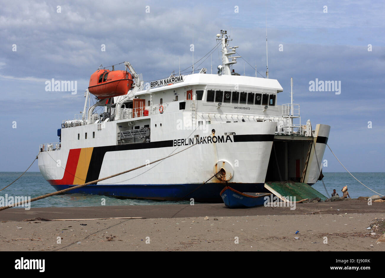 The Berlin Nakroma cargo ferry on the beach in Pante Macassar, Oecussi ...