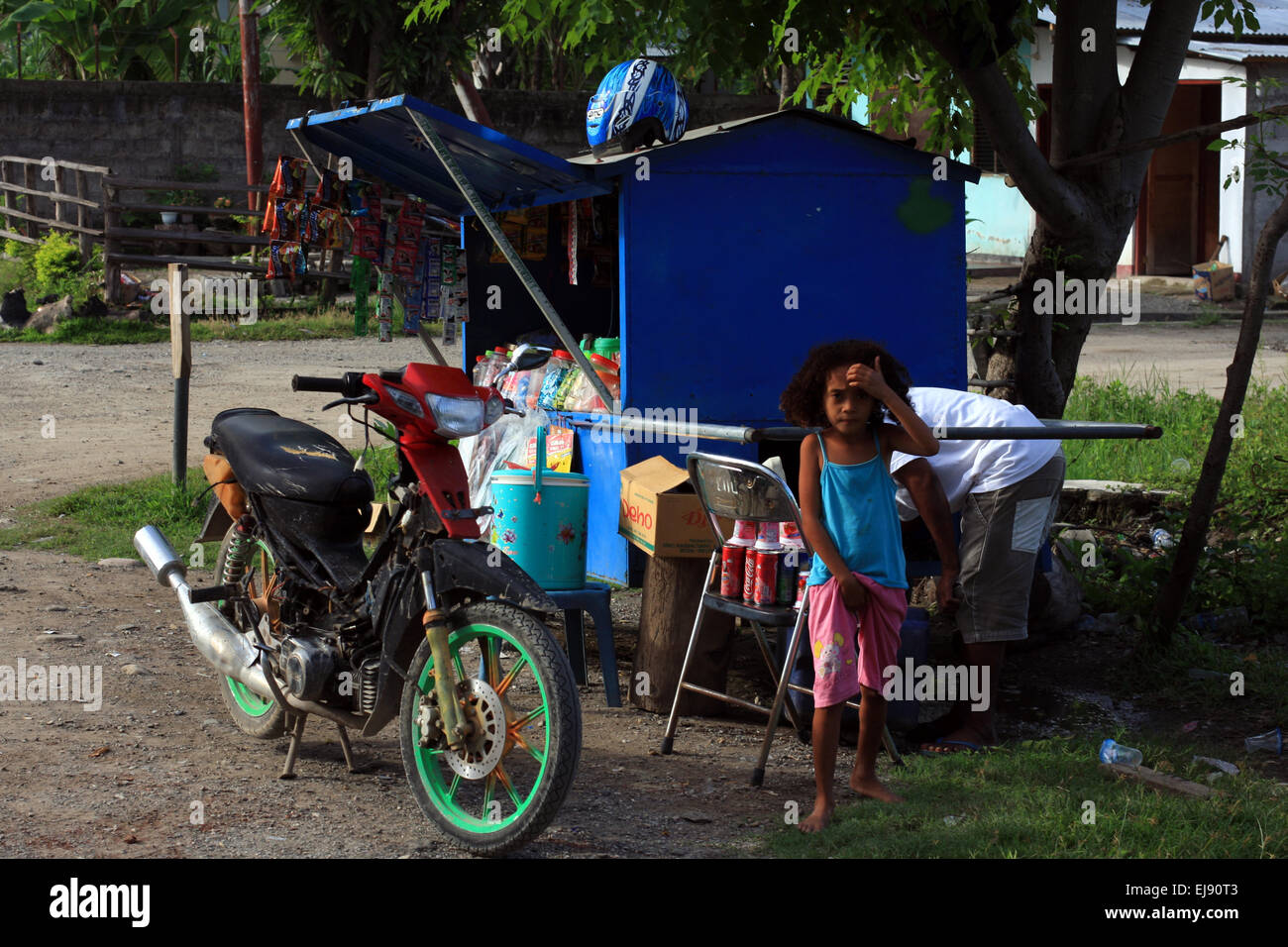 People next to a roadside stall in Pante Macassar, Oecusse, Timor-Leste ...