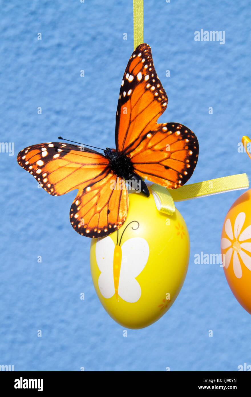 easter eggs with butterfly in blue background Stock Photo - Alamy