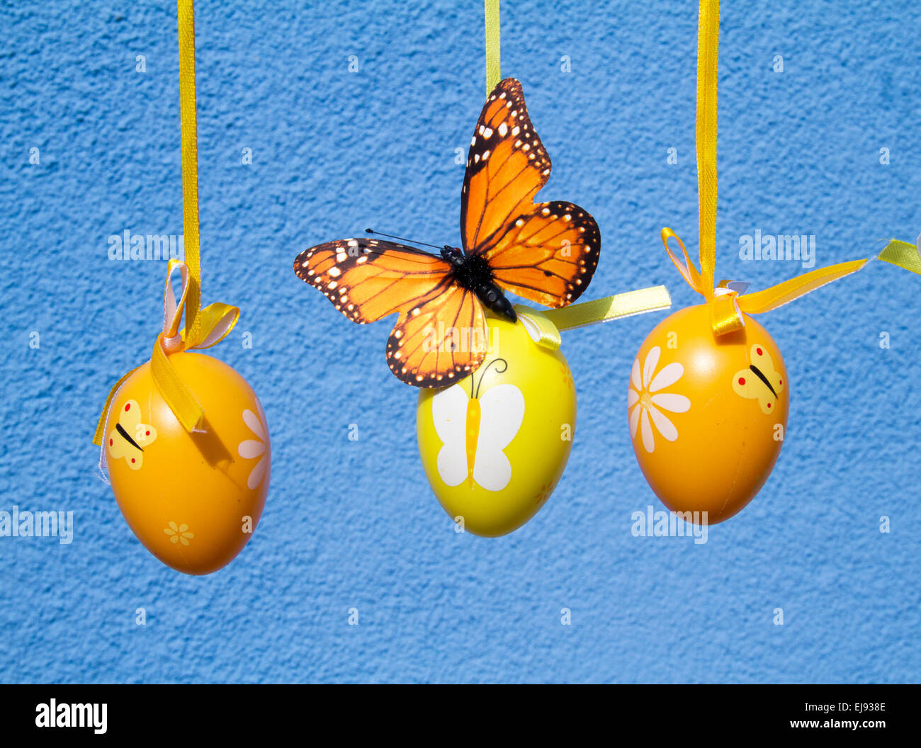 easter eggs with butterfly in blue background Stock Photo - Alamy