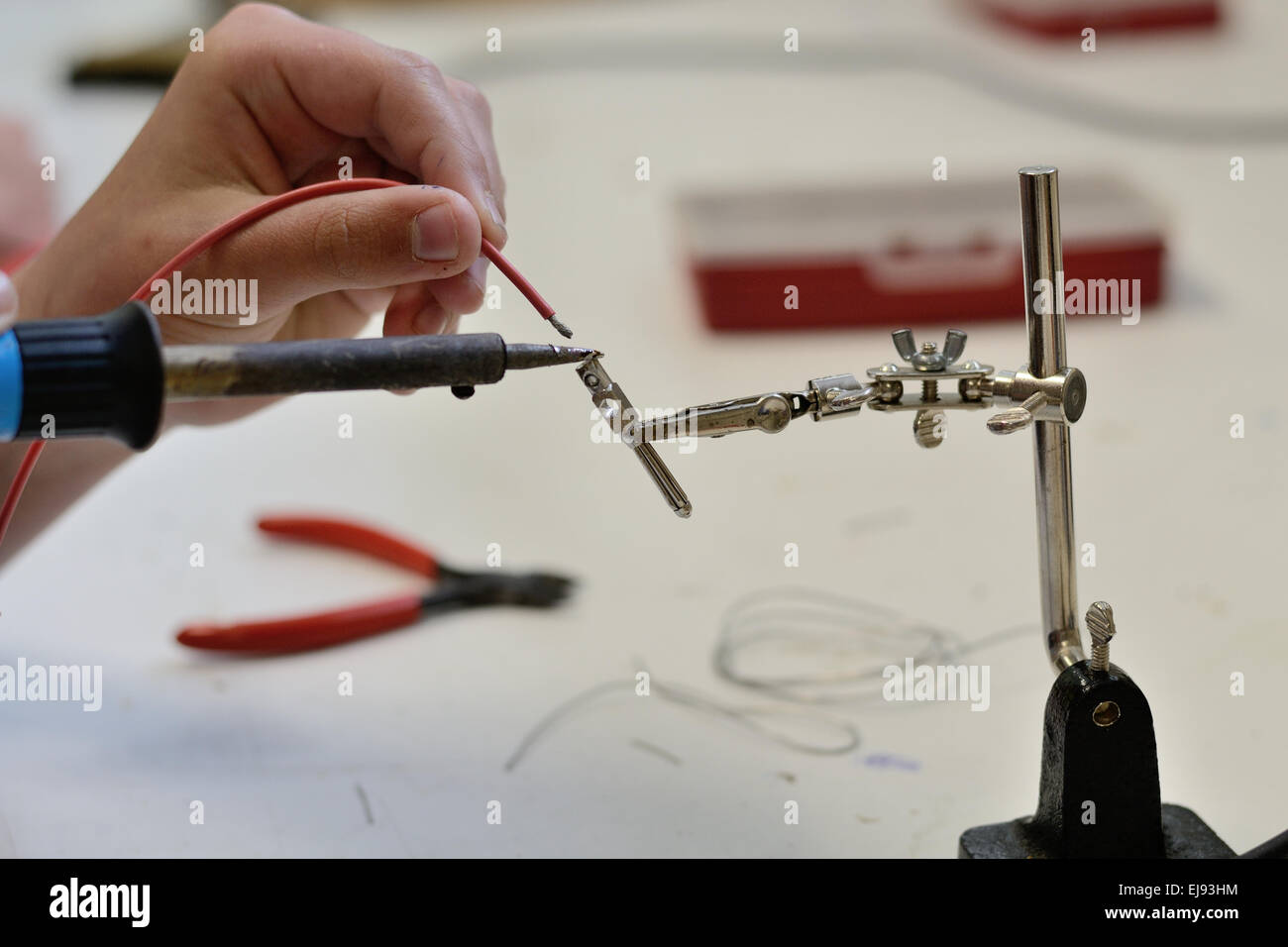 Soldering electrical parts Stock Photo - Alamy