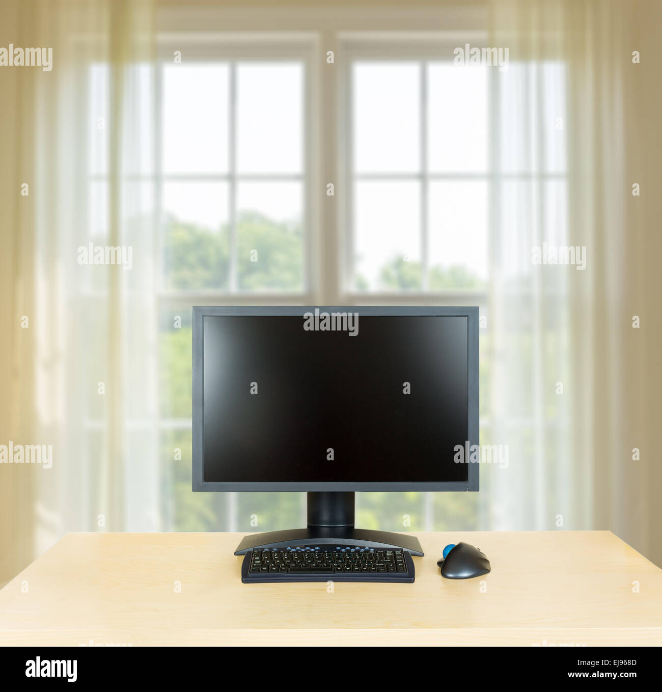 Plain office desk with monitor with window Stock Photo - Alamy