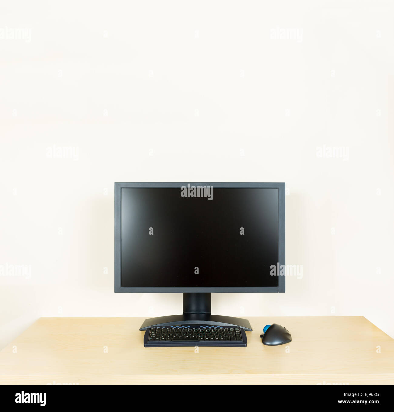 Plain office desk with monitor Stock Photo - Alamy