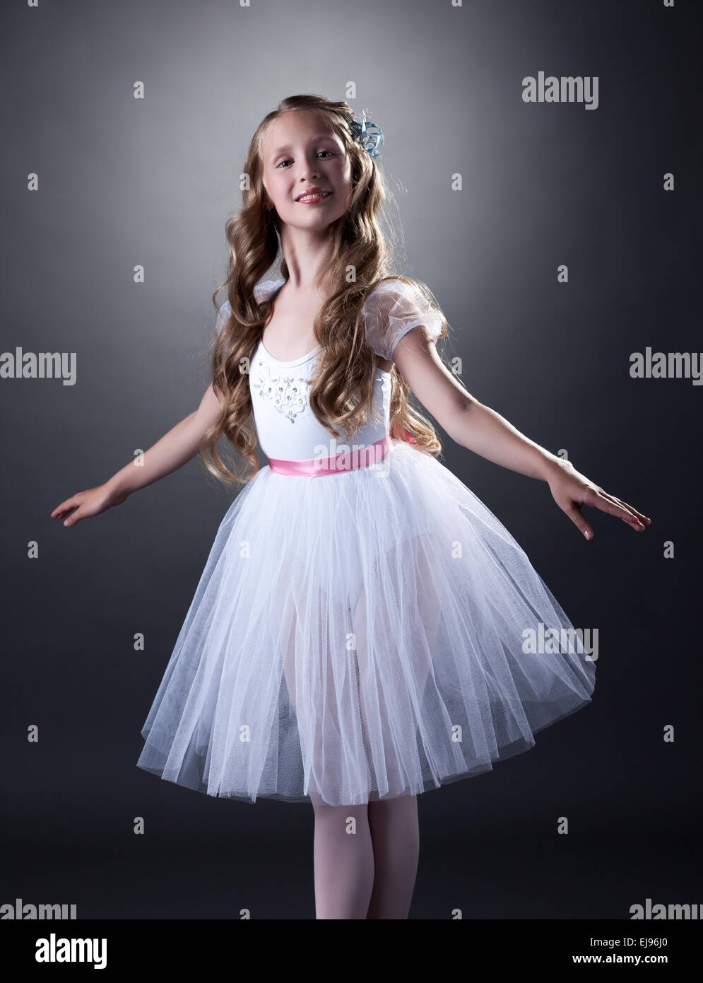 Smiling young ballerina posing at camera Stock Photo - Alamy
