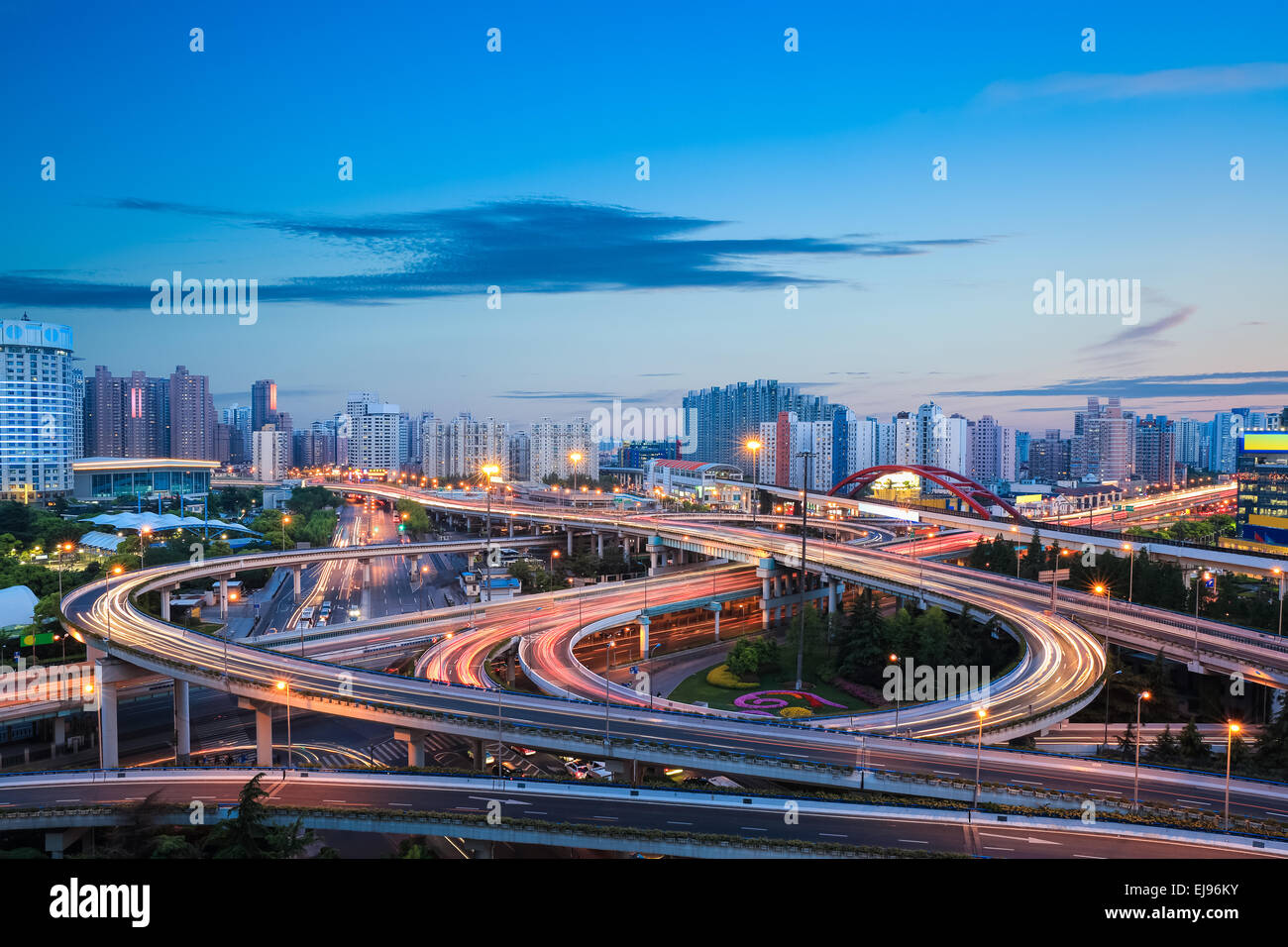 modern city interchange overpass in nightfall Stock Photo - Alamy