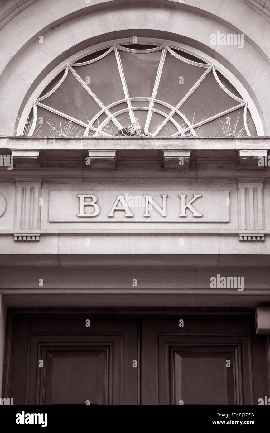 Bank Sign over Entrance Door in Black and White Sepia Tone Stock Photo ...