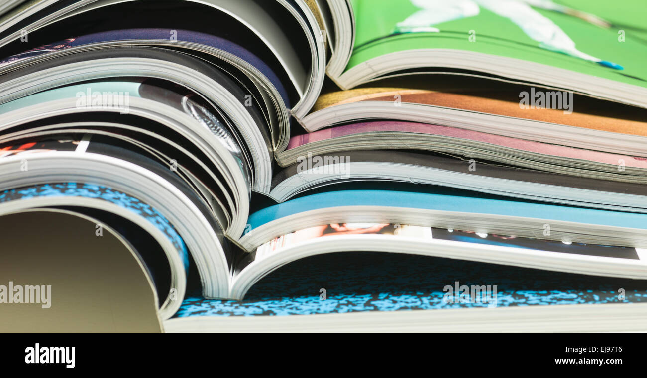 stack of open magazines Stock Photo - Alamy