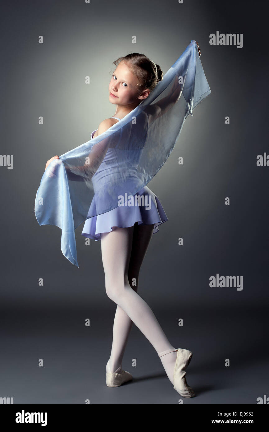 Playful little dancer posing at camera Stock Photo - Alamy