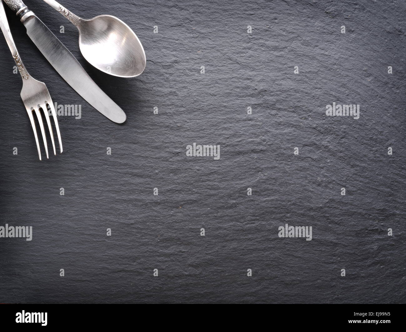 Cooking utensils on a dark gray background Stock Photo - Alamy
