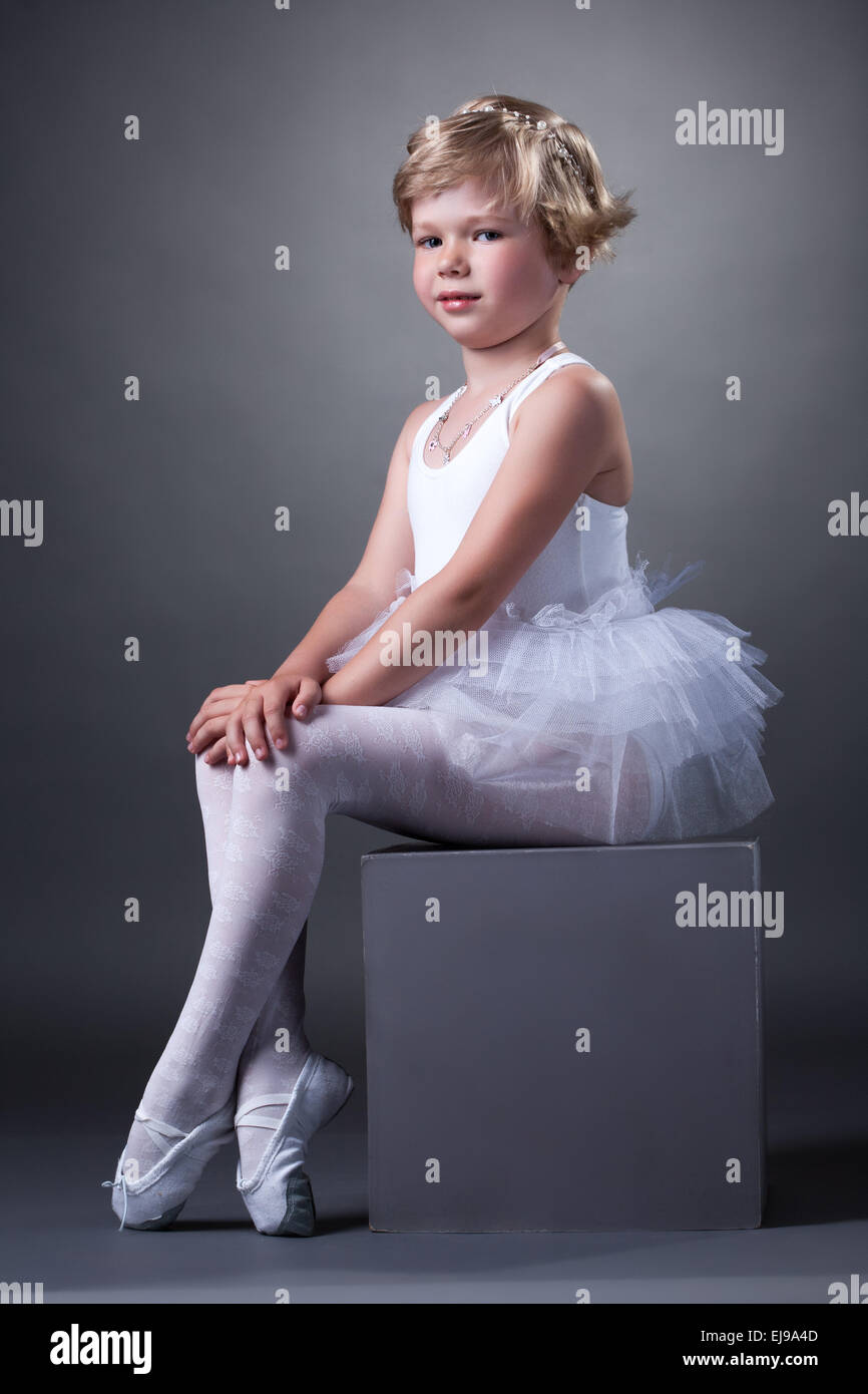 Studio shot of adorable girl posing in tutu Stock Photo - Alamy