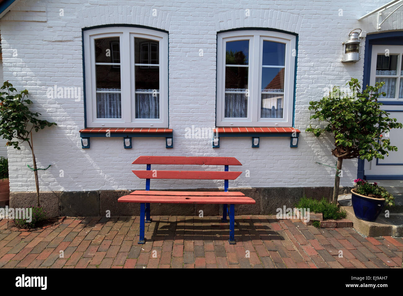 Bench and house Stock Photo - Alamy