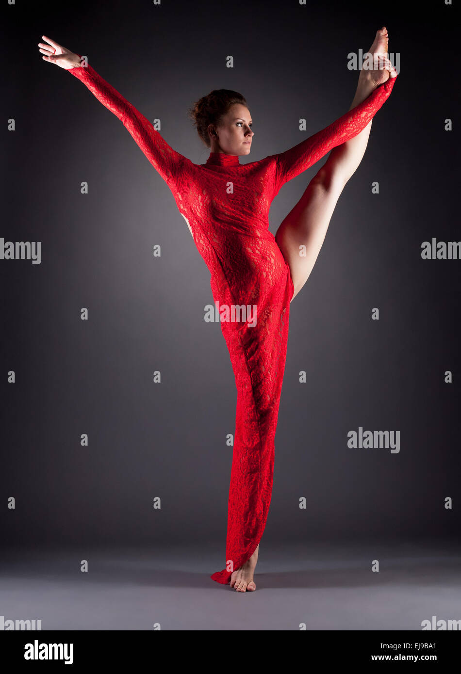 Beautiful slim dancer doing vertical split Stock Photo - Alamy