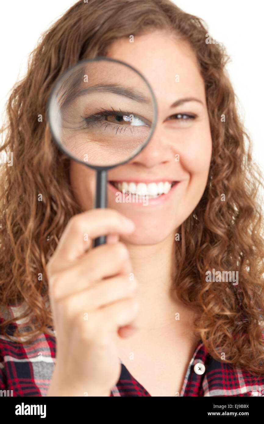 Young female student with magnifying glass Stock Photo - Alamy