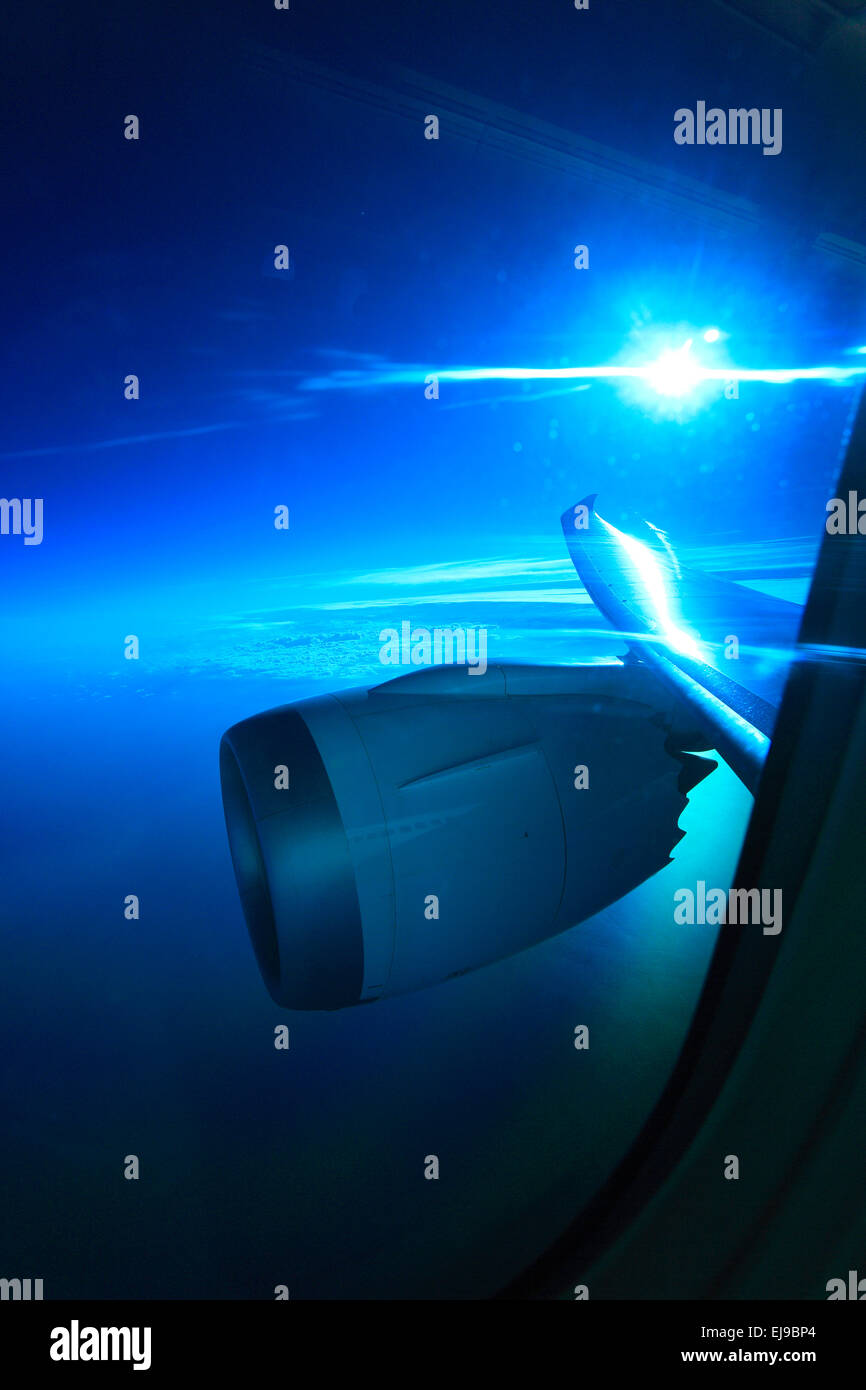 View from aeroplane window showing the blue dimming effect windows in ...