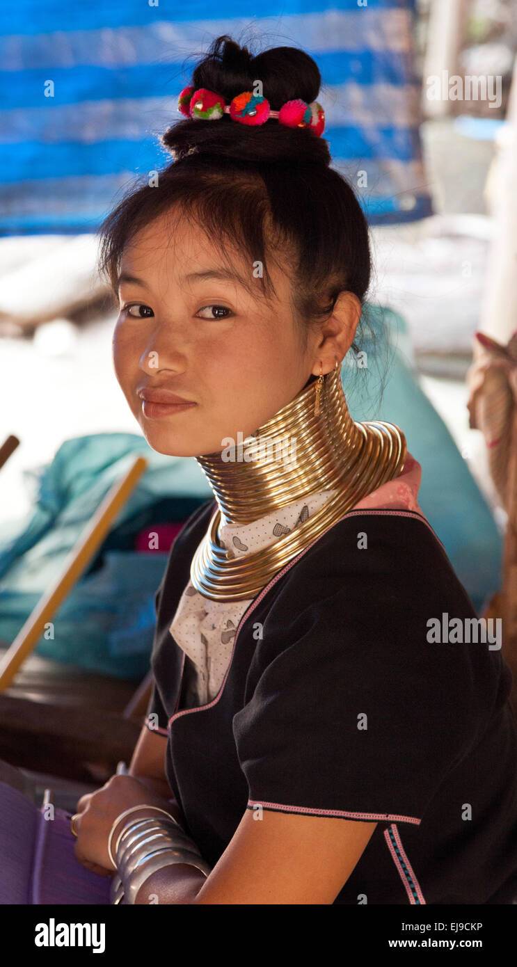 Young woman from the Kayan hill tribe, Myanmar, Burma. wearing the traditional brass neck rings ...