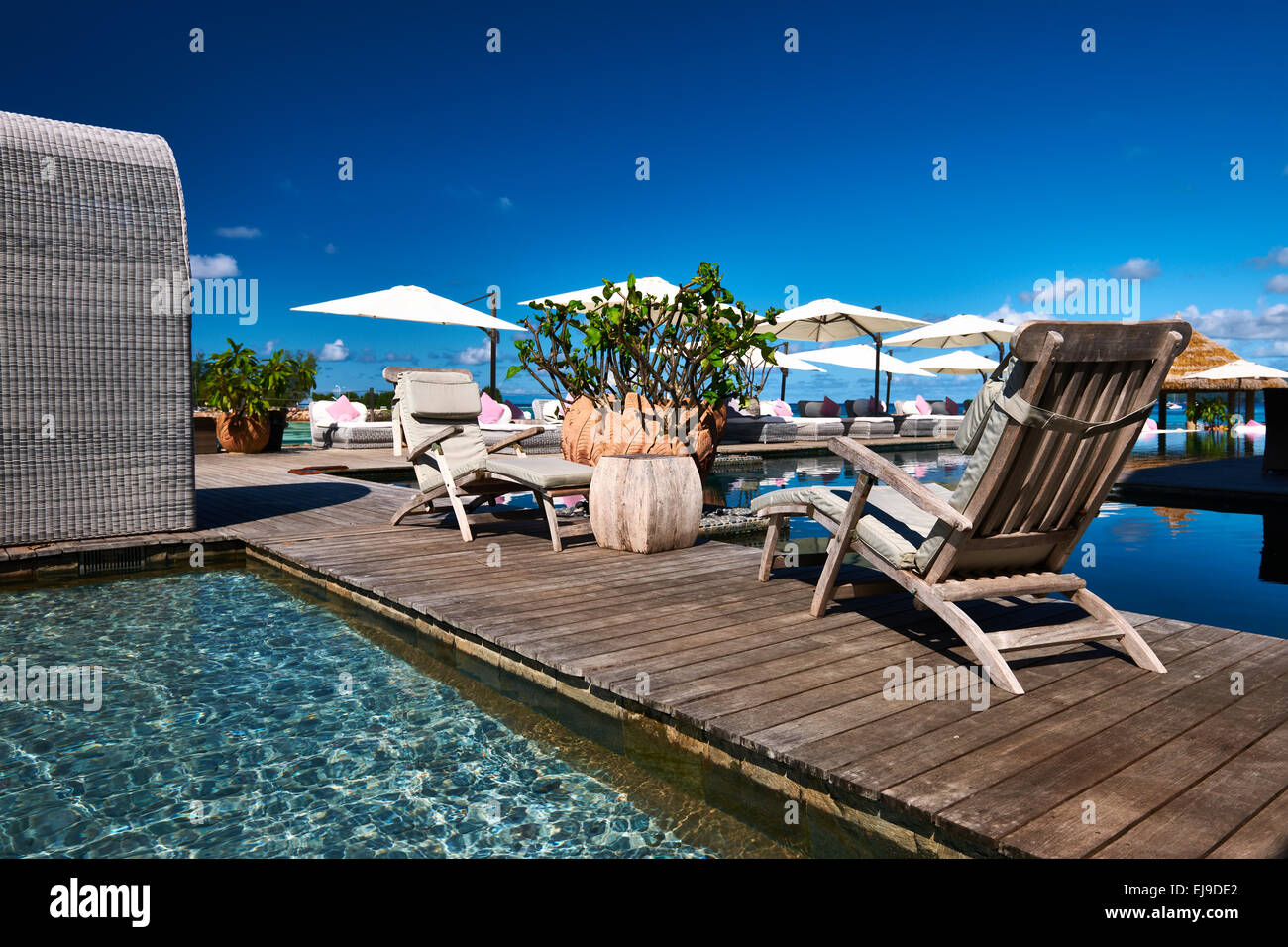 Luxury poolside jetty Stock Photo - Alamy