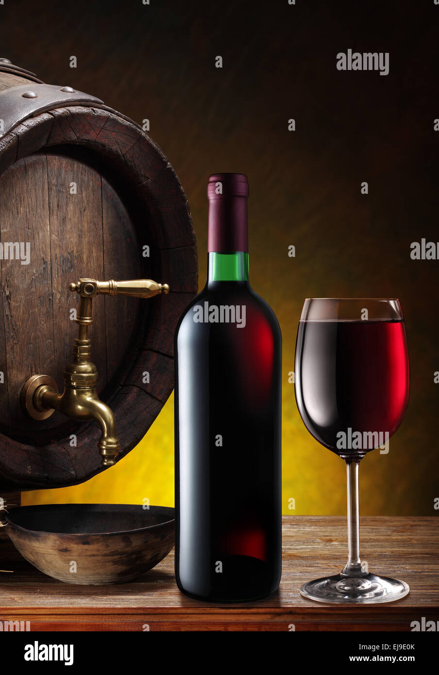Still-life with glass of wine, bottle and barrel on the table in the ...
