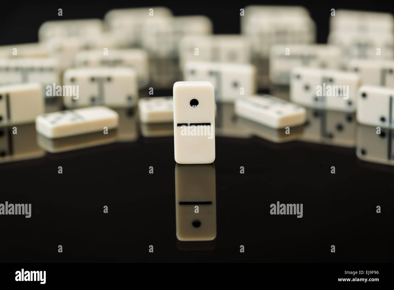 White dominoes showing leader or winner Stock Photo - Alamy