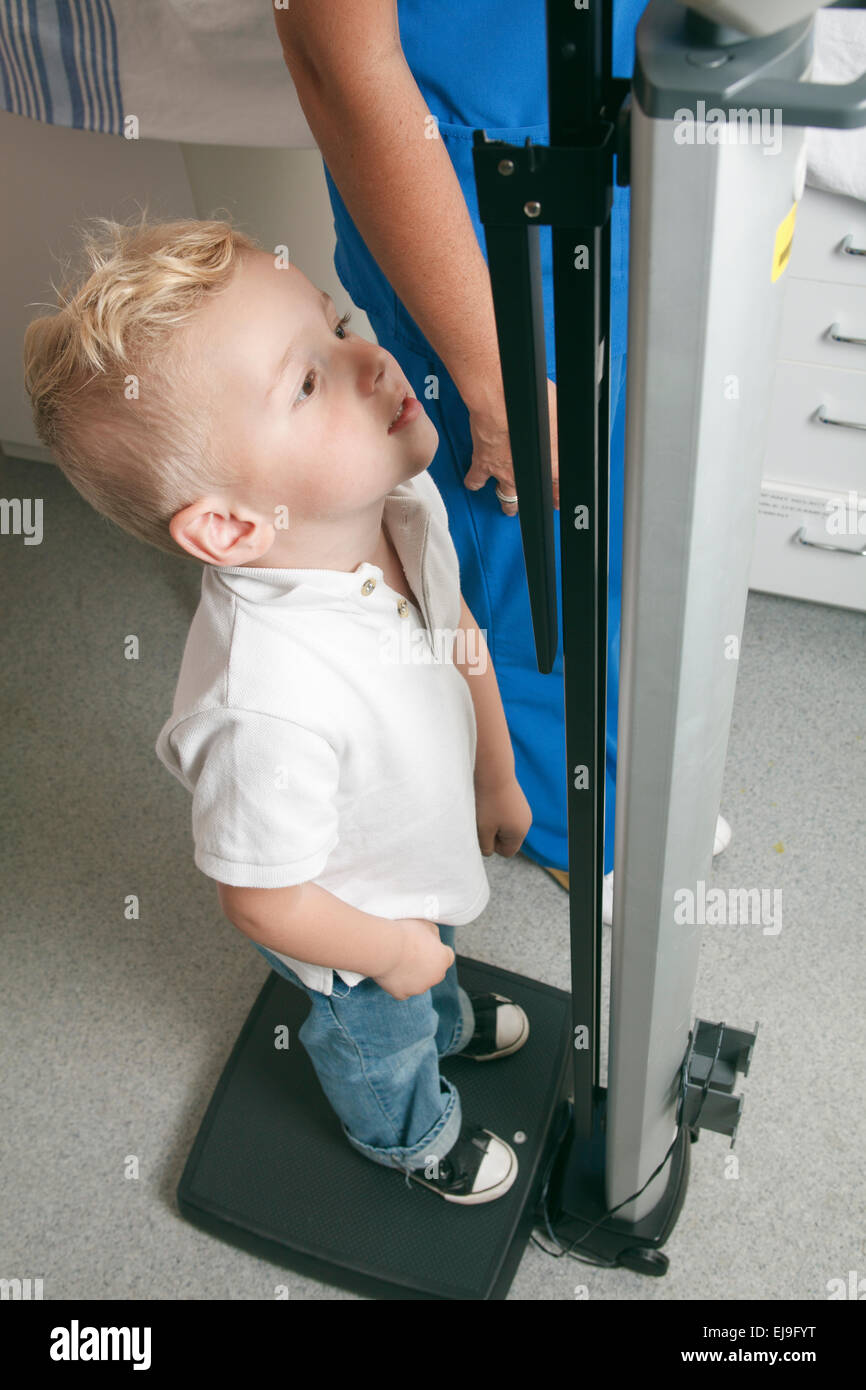 young boy get measure in the hospital pediatrician Stock Photo - Alamy