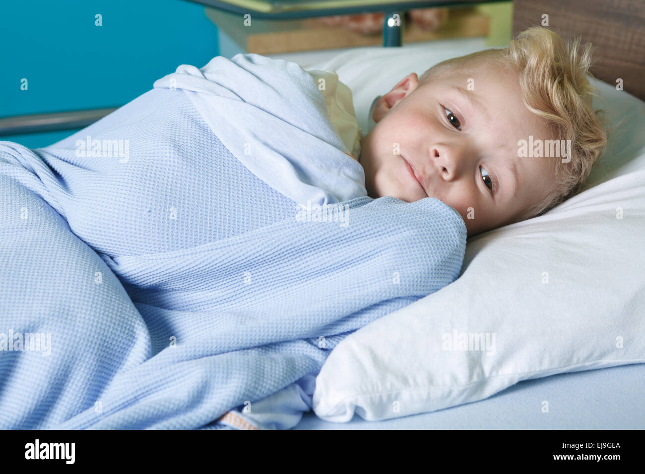 sick little boy in a hospital bed Stock Photo - Alamy