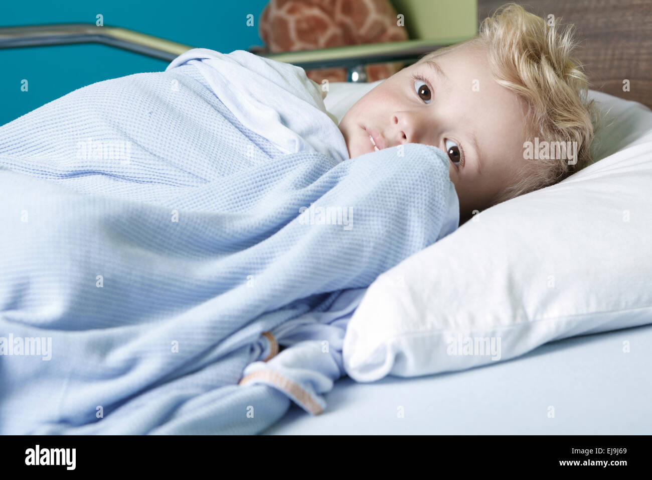 sick little boy in a hospital bed Stock Photo - Alamy