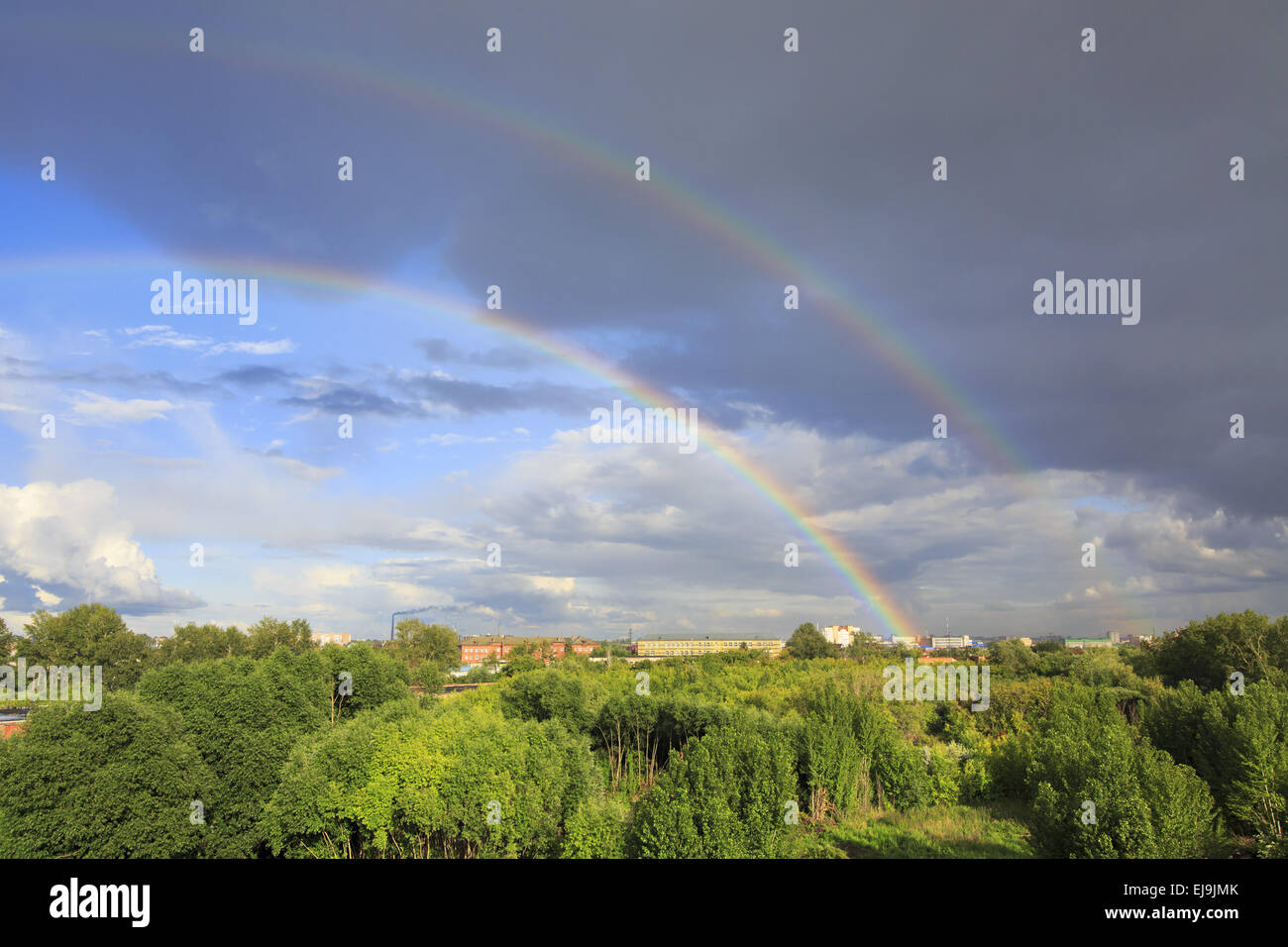 Beautiful double rainbow over the city Stock Photo - Alamy