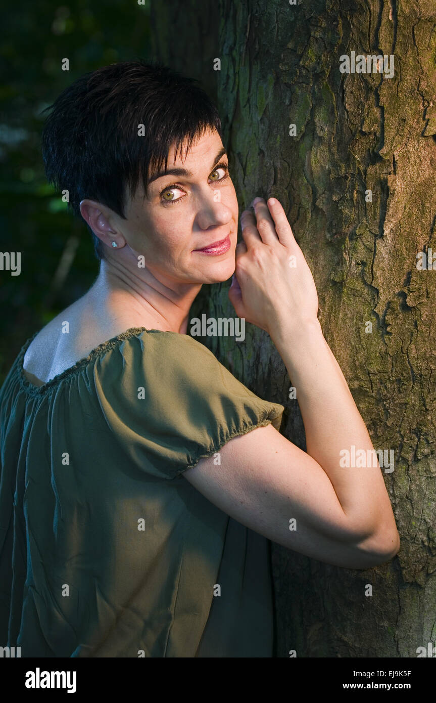 beautyful woman on a tree Stock Photo - Alamy