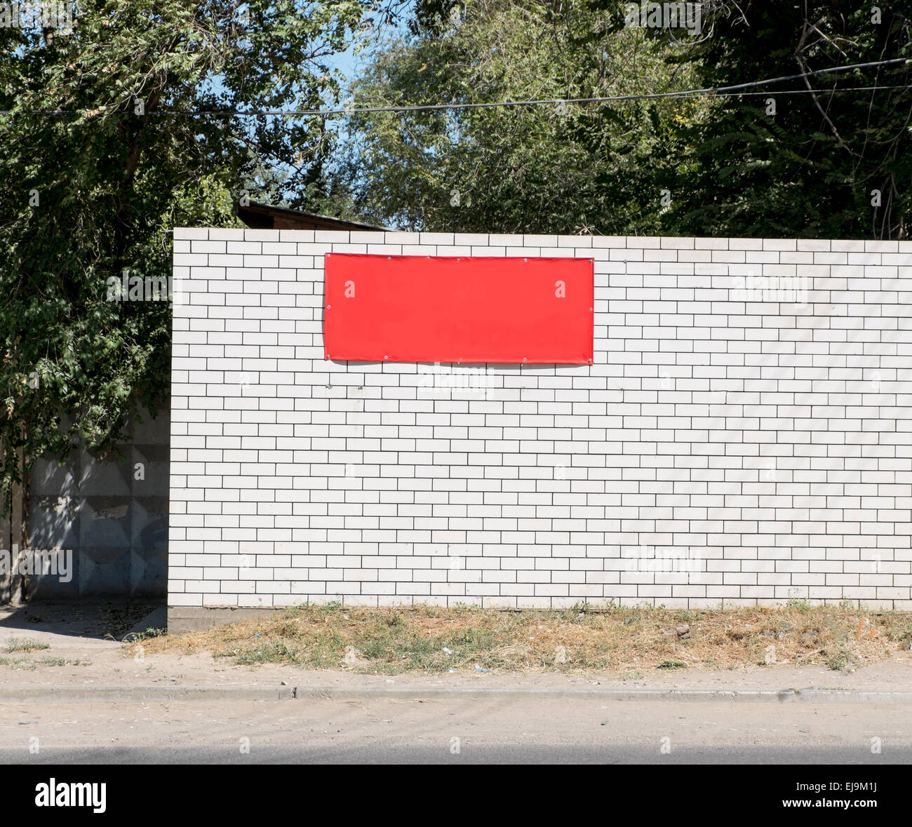 White brick wall background with red banner Stock Photo - Alamy