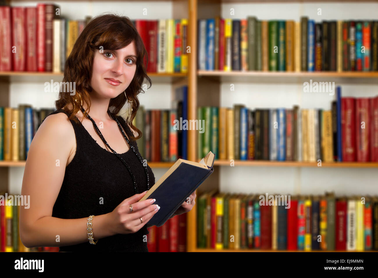 Portrait of clever student with open book Stock Photo - Alamy