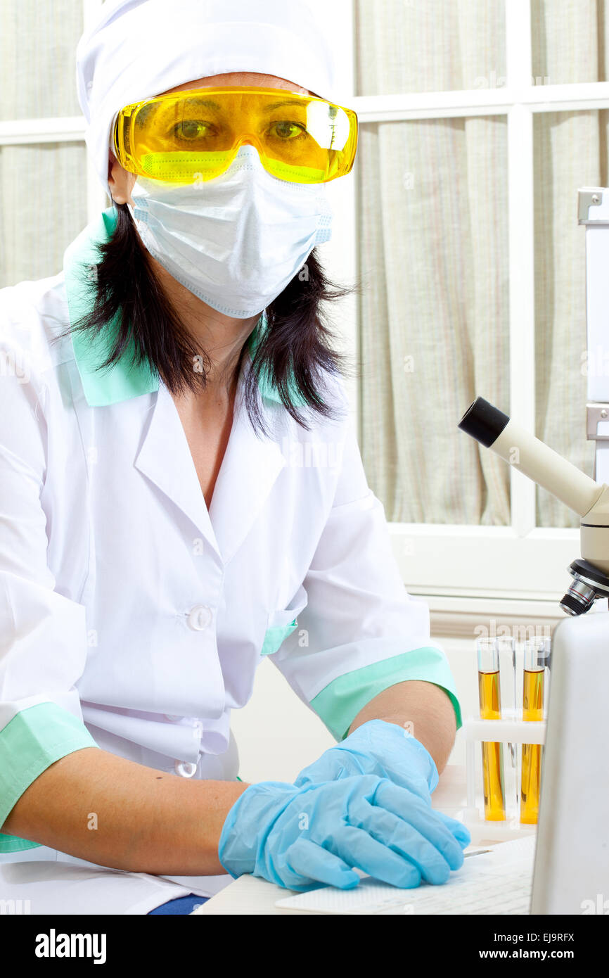 scientist with microscope and computer Stock Photo - Alamy