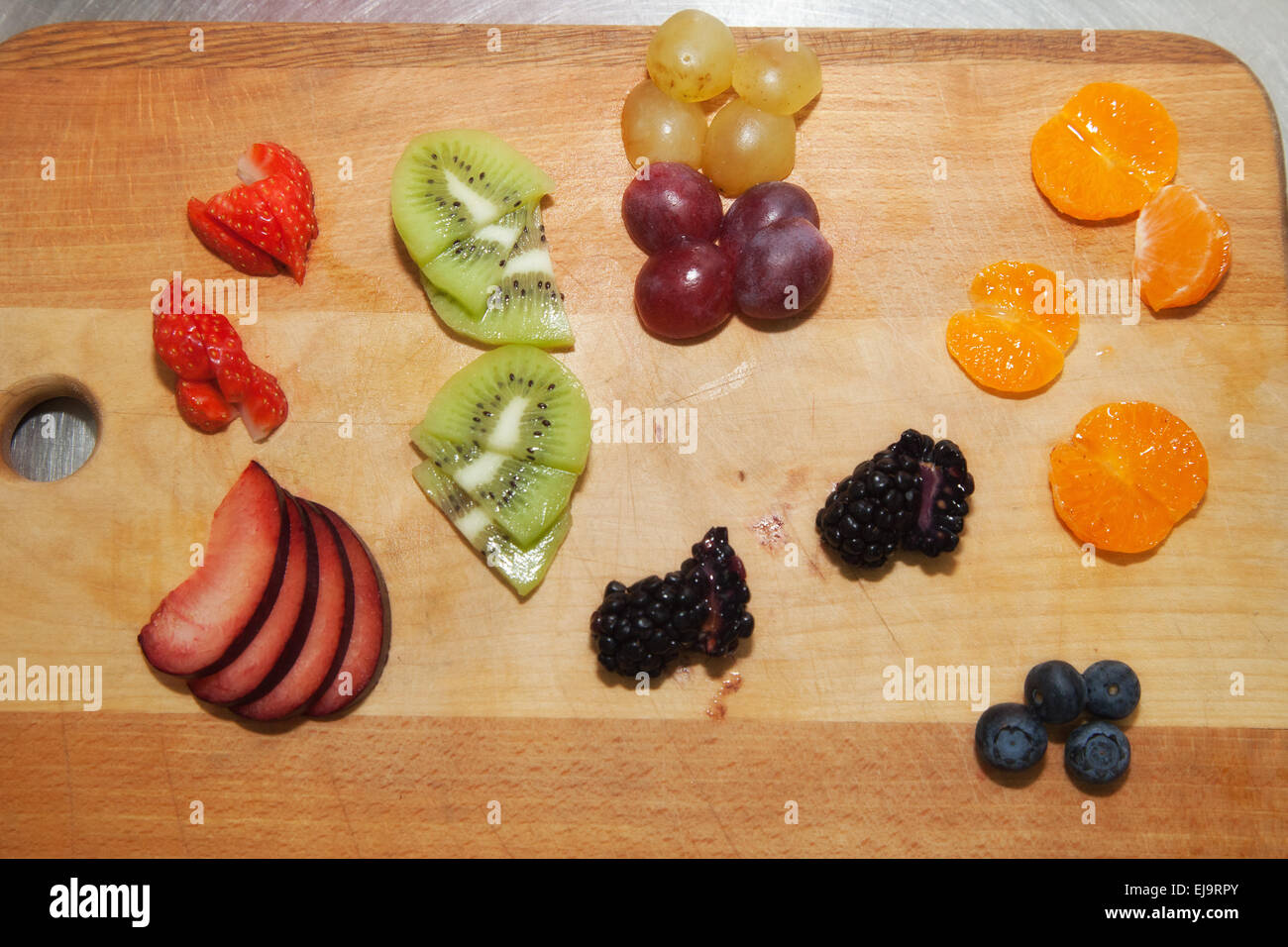 cutting fruits on board. sweet food Stock Photo - Alamy