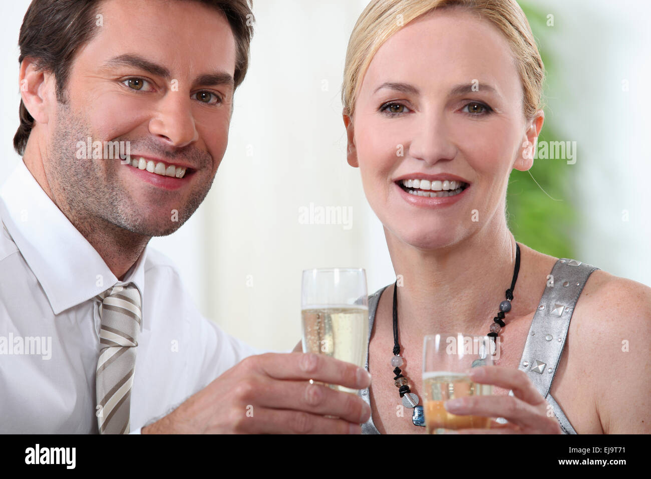 couple at a party Stock Photo - Alamy
