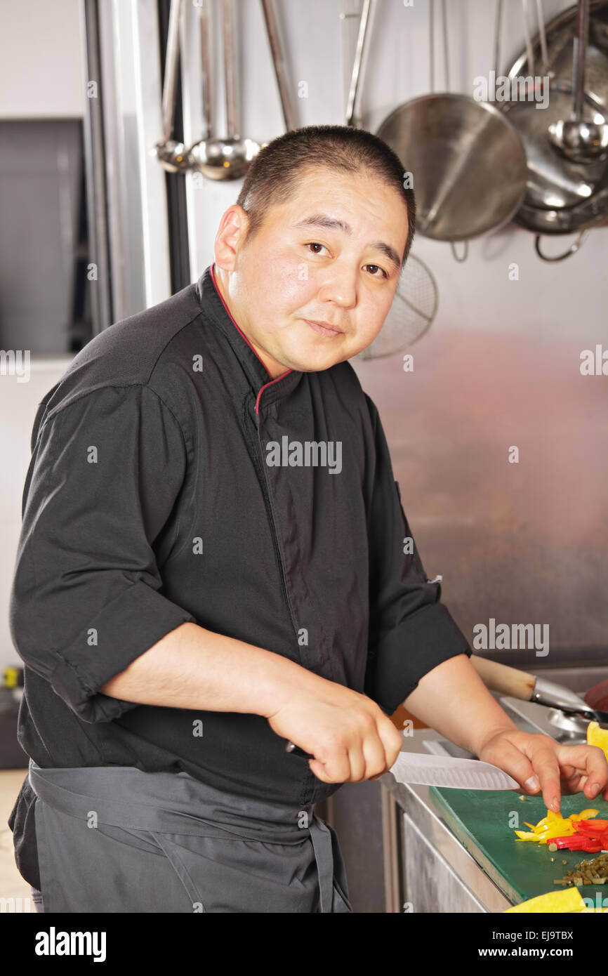 Chef with paprika pepper Stock Photo - Alamy