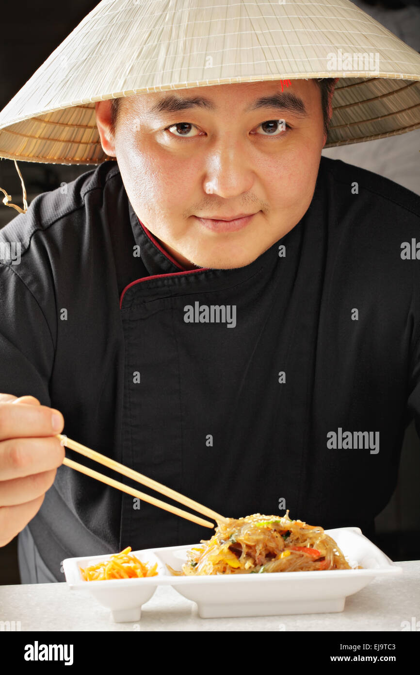 Asian man in conical hat hi-res stock photography and images - Alamy