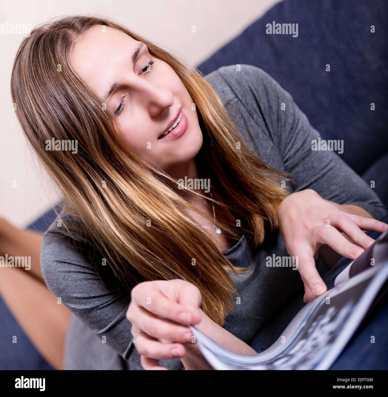 Woman reading magazine hi-res stock photography and images - Alamy
