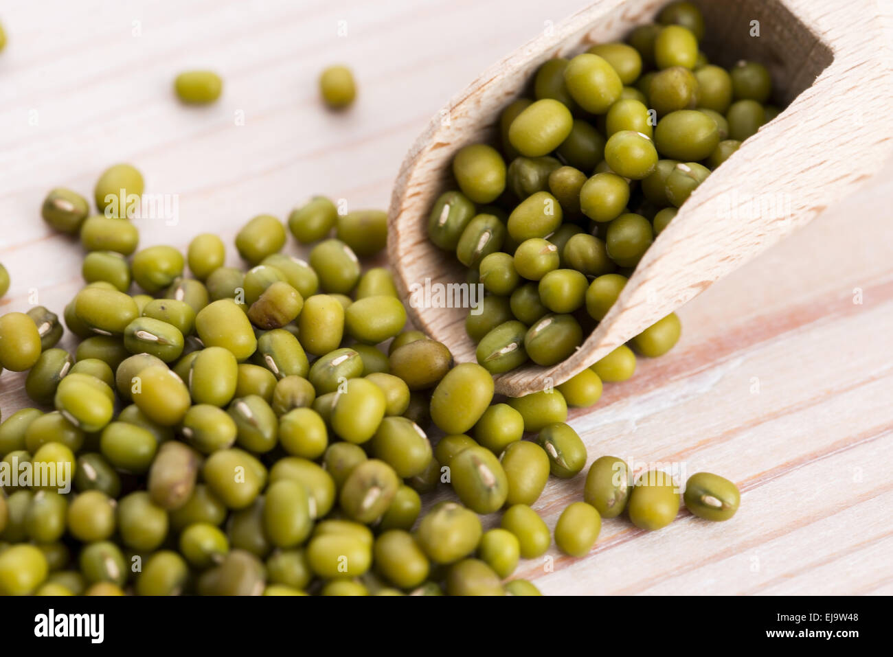 Mung beans over wooden spoon Stock Photo - Alamy