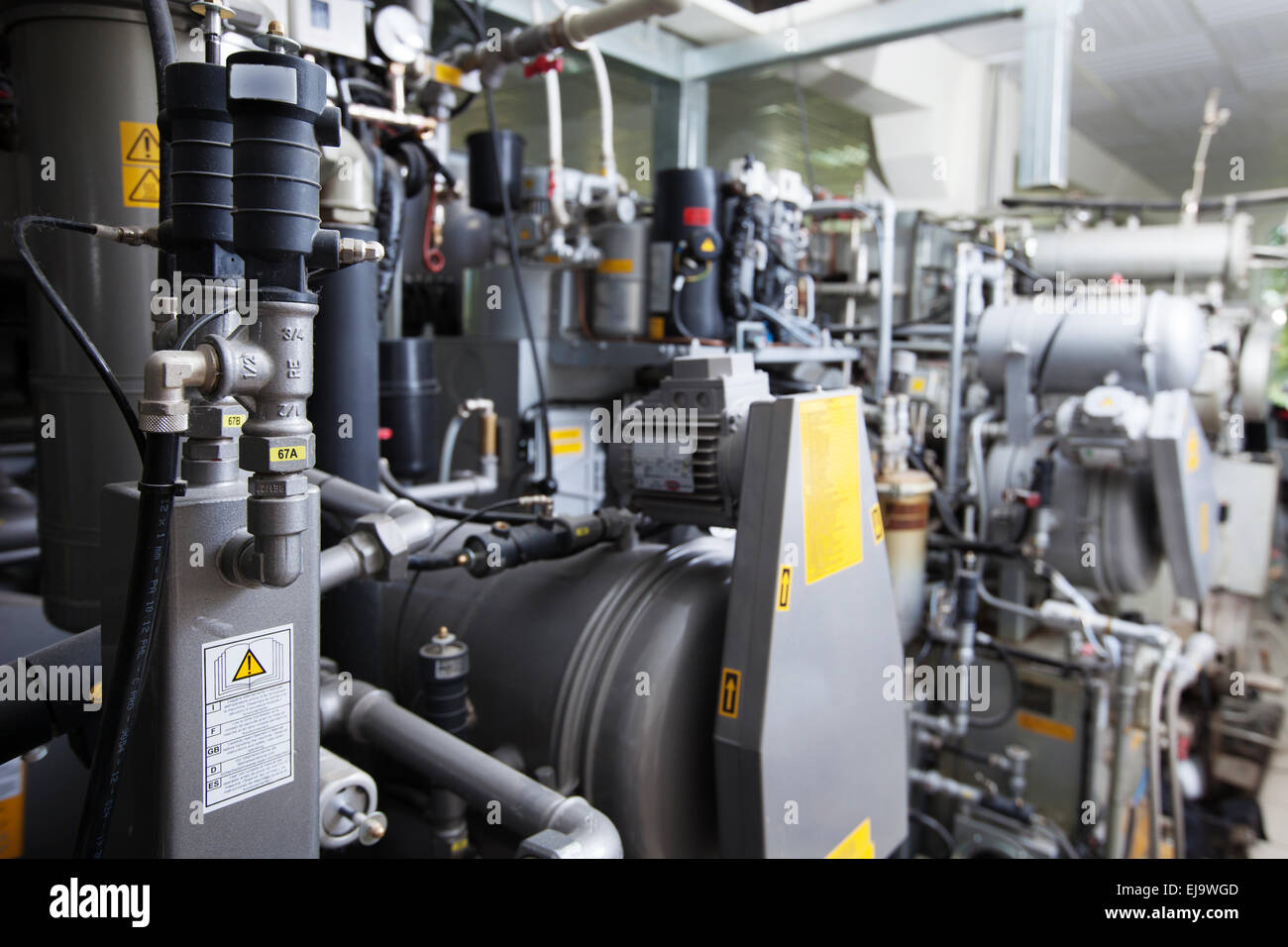 Modern automated equipment in dry cleaning Stock Photo - Alamy