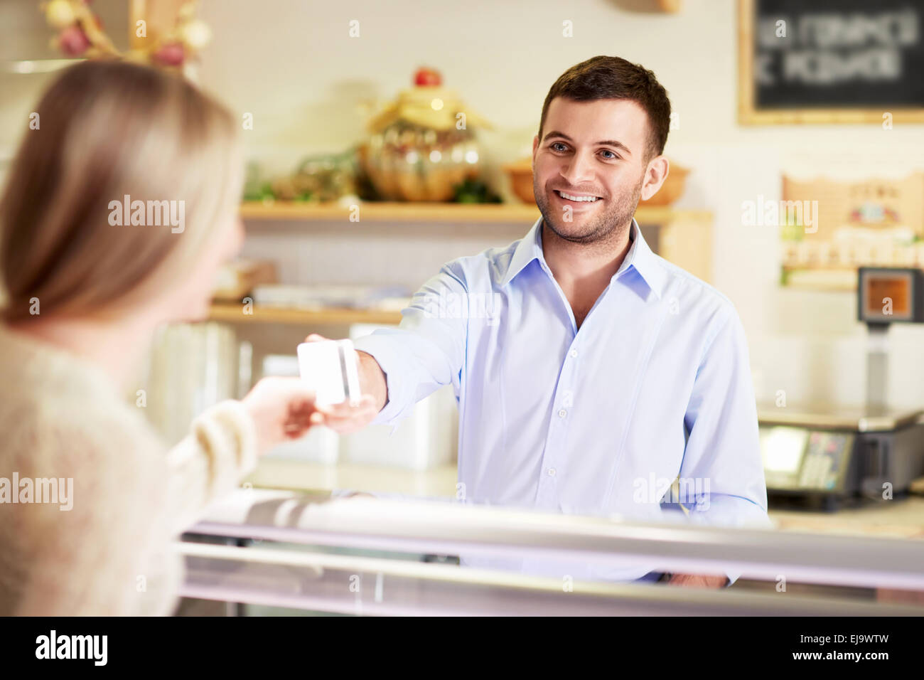 At the counter Stock Photo - Alamy