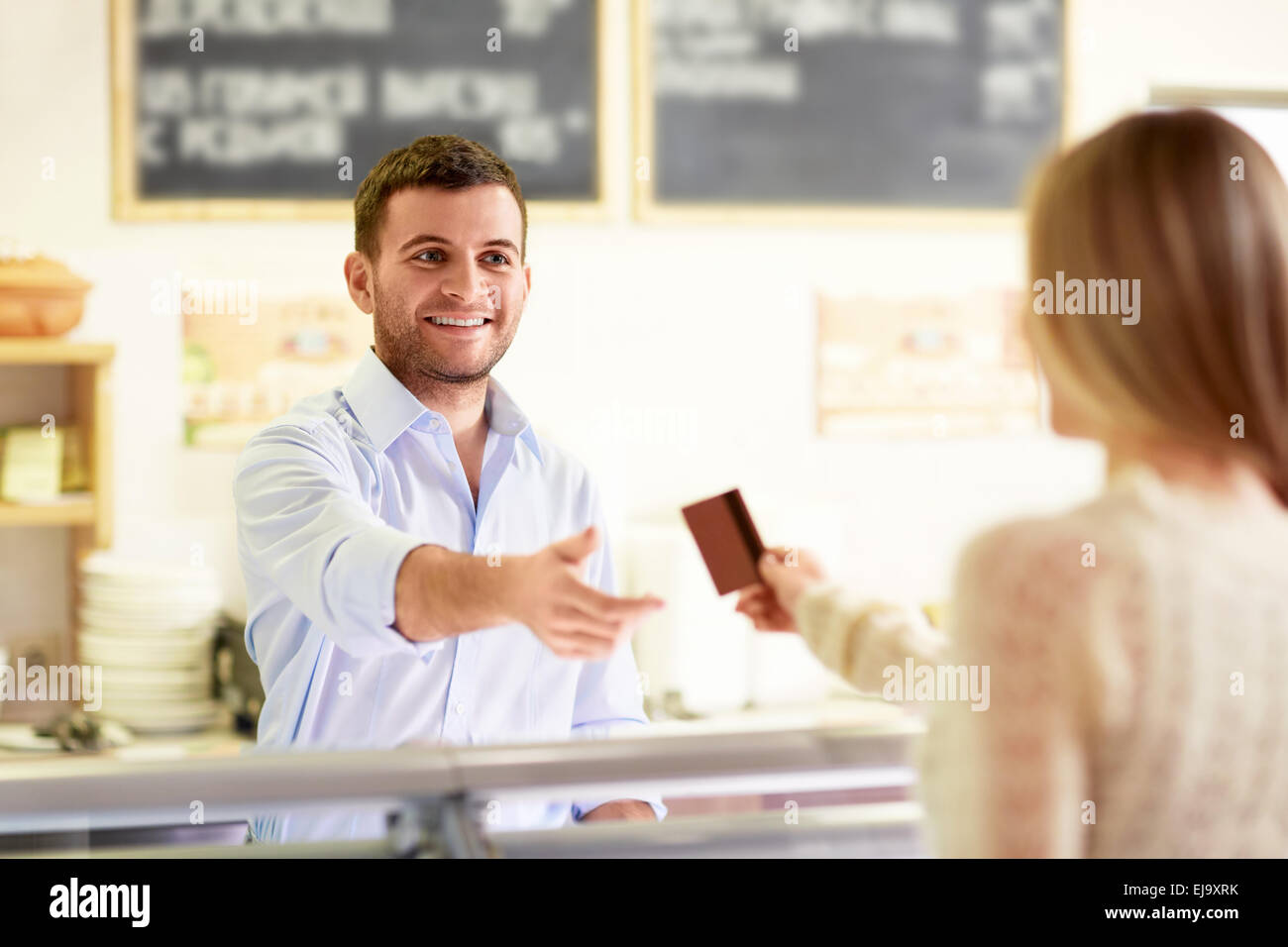 At the counter Stock Photo - Alamy