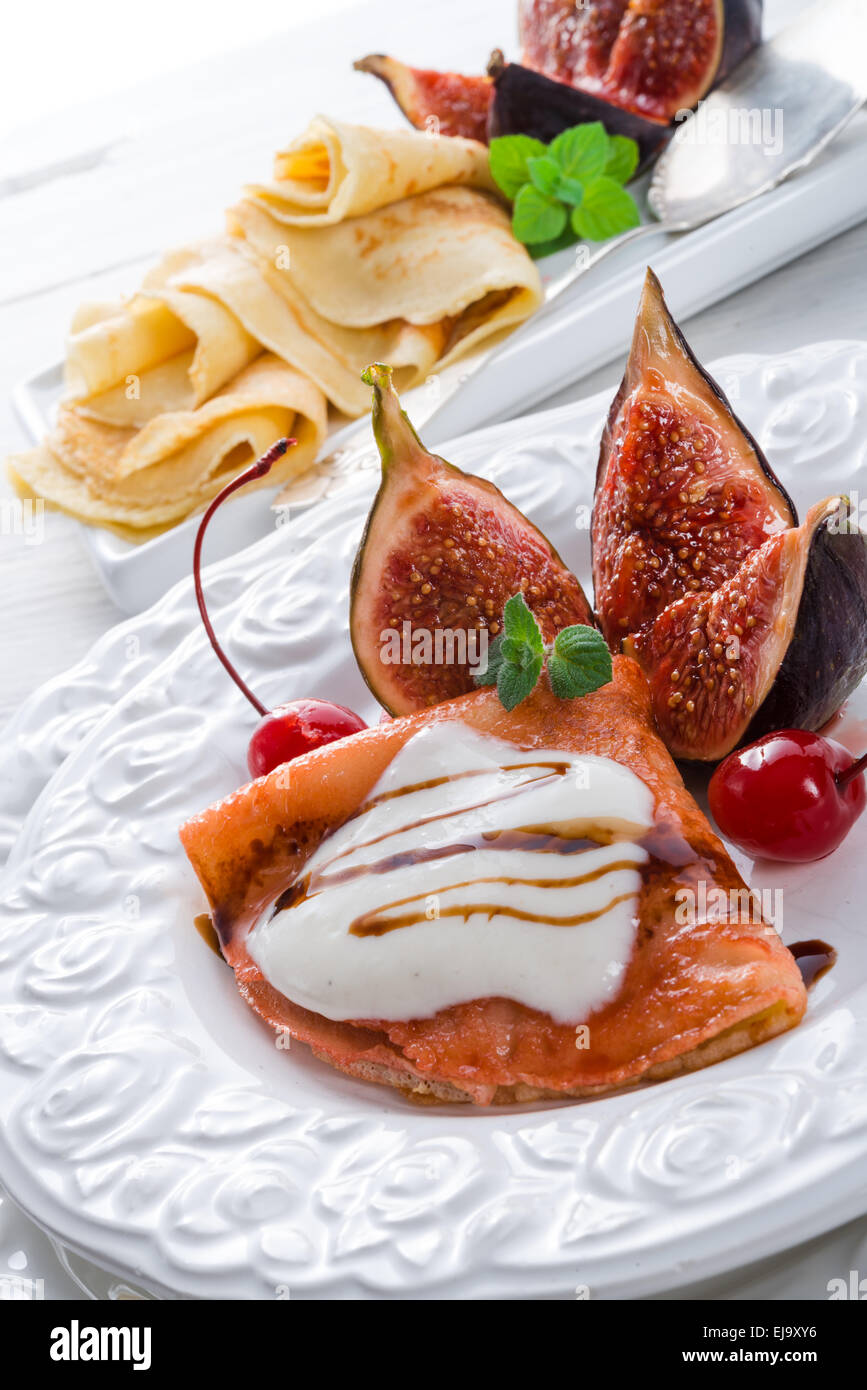 flambe pancakes with figs and cherries Stock Photo - Alamy