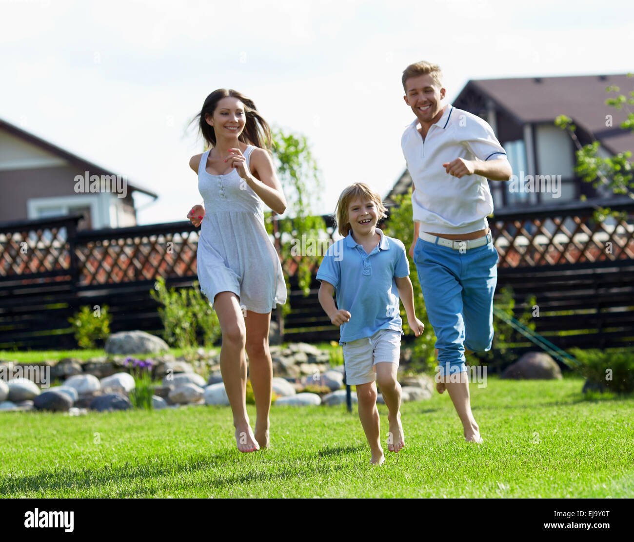 Family running house hi-res stock photography and images - Alamy