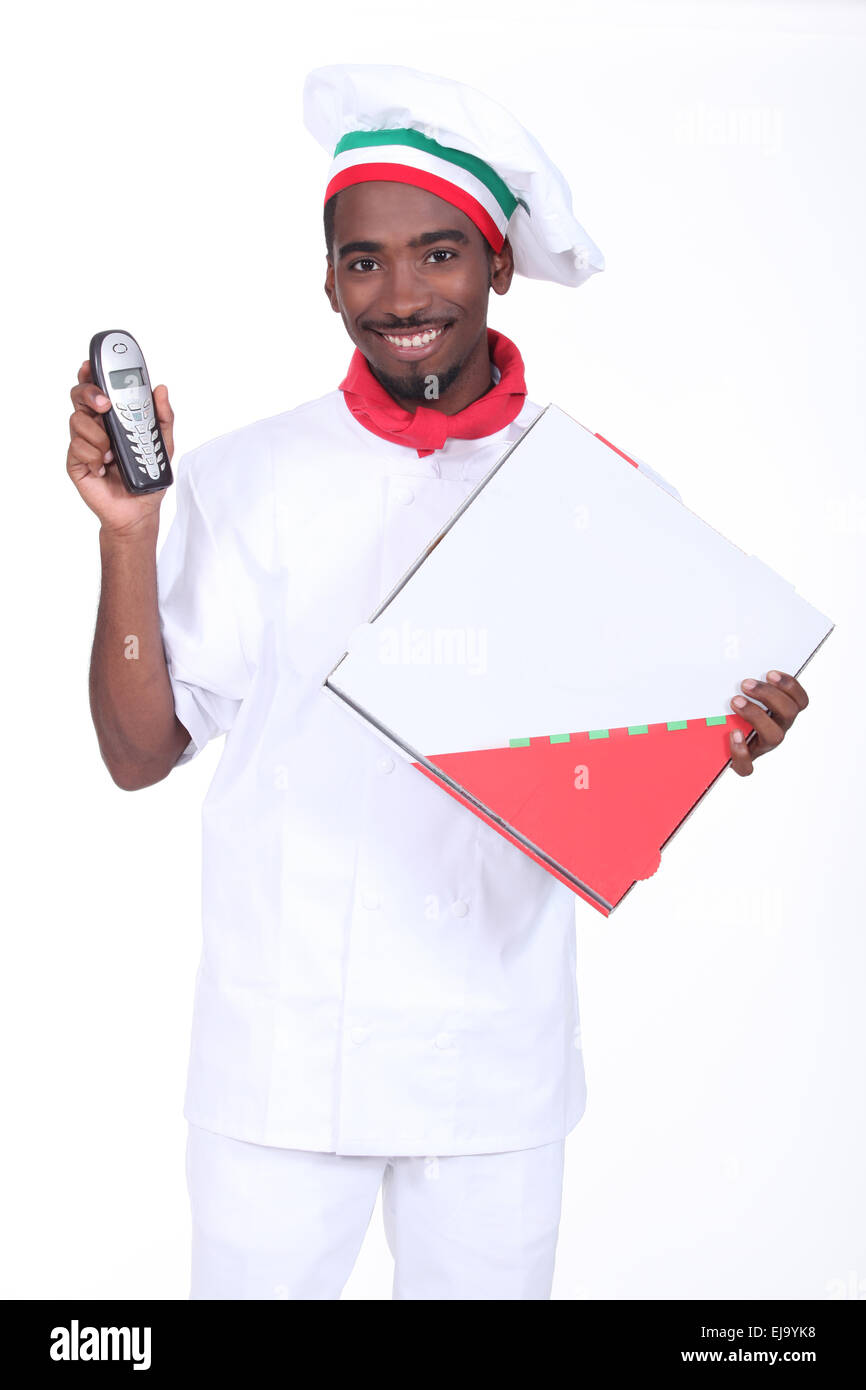 Chef with a telephone and a take away pizza box Stock Photo - Alamy