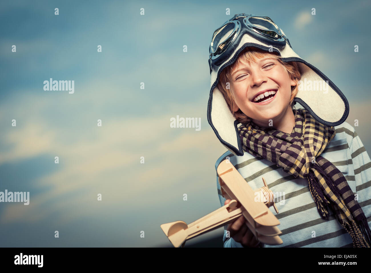 Smiling active boy holding hi-res stock photography and images - Alamy
