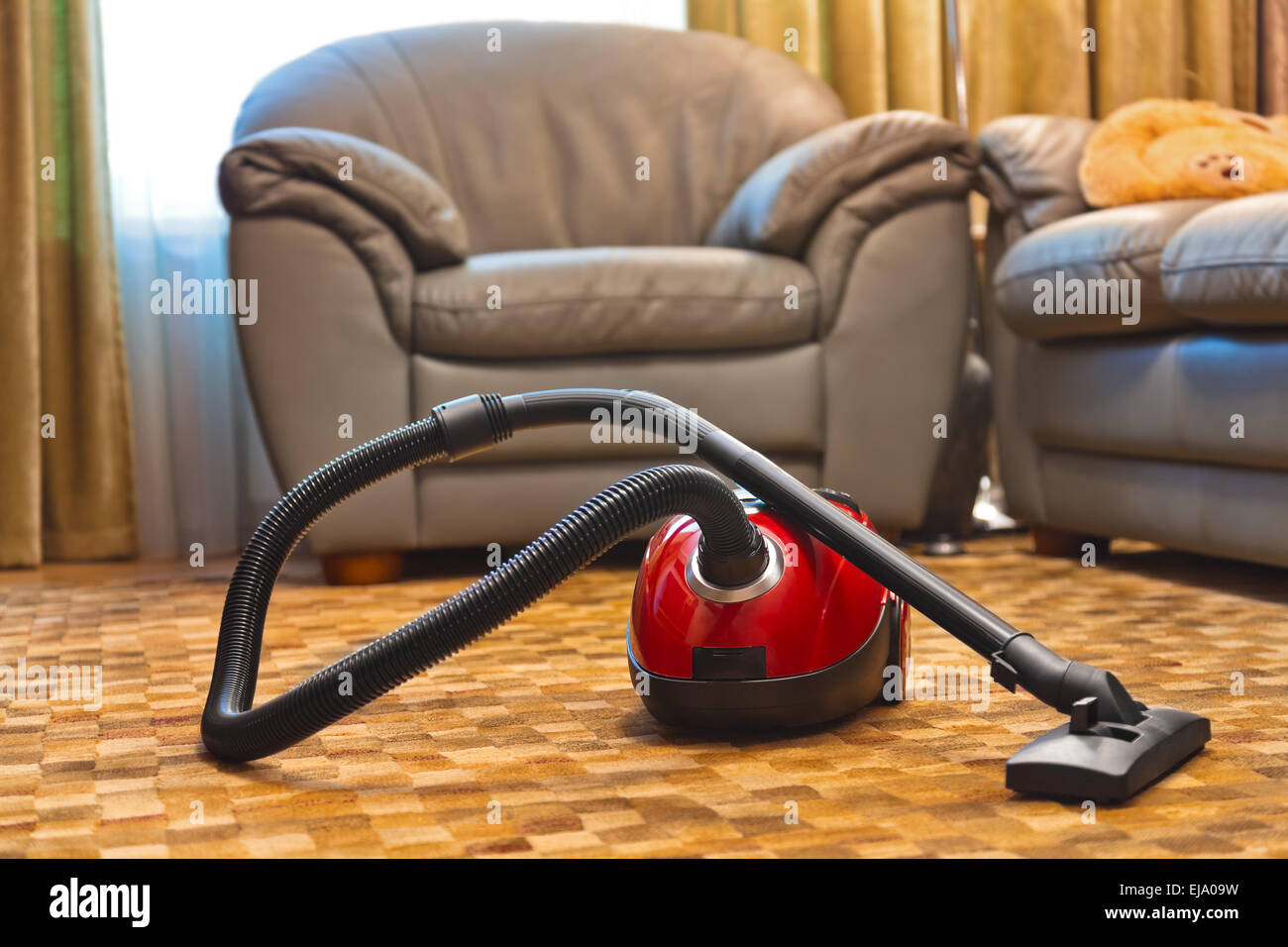 Vacuum cleaner in room Stock Photo - Alamy