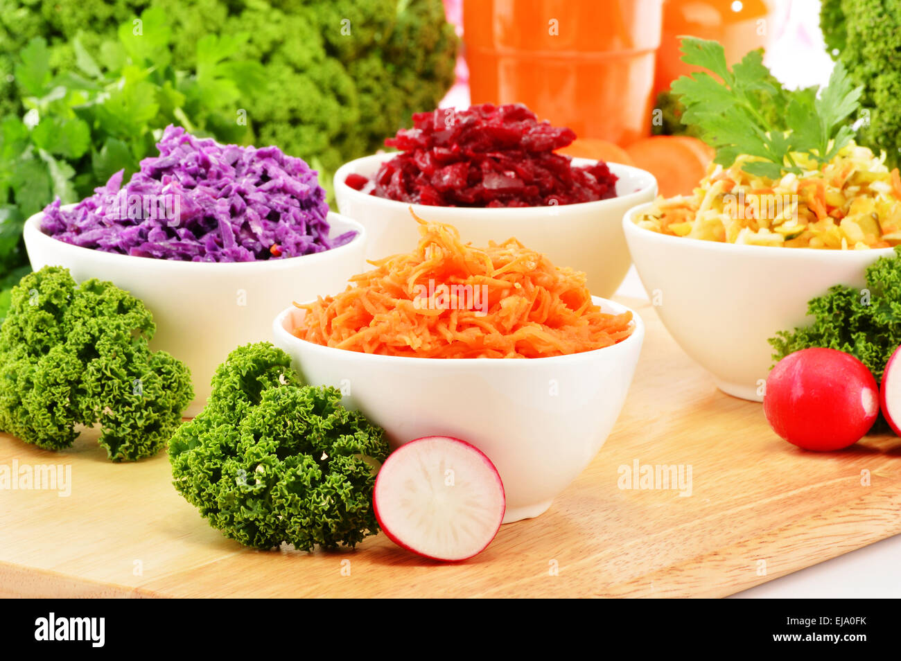 Composition with four vegetable salad bowls Stock Photo - Alamy