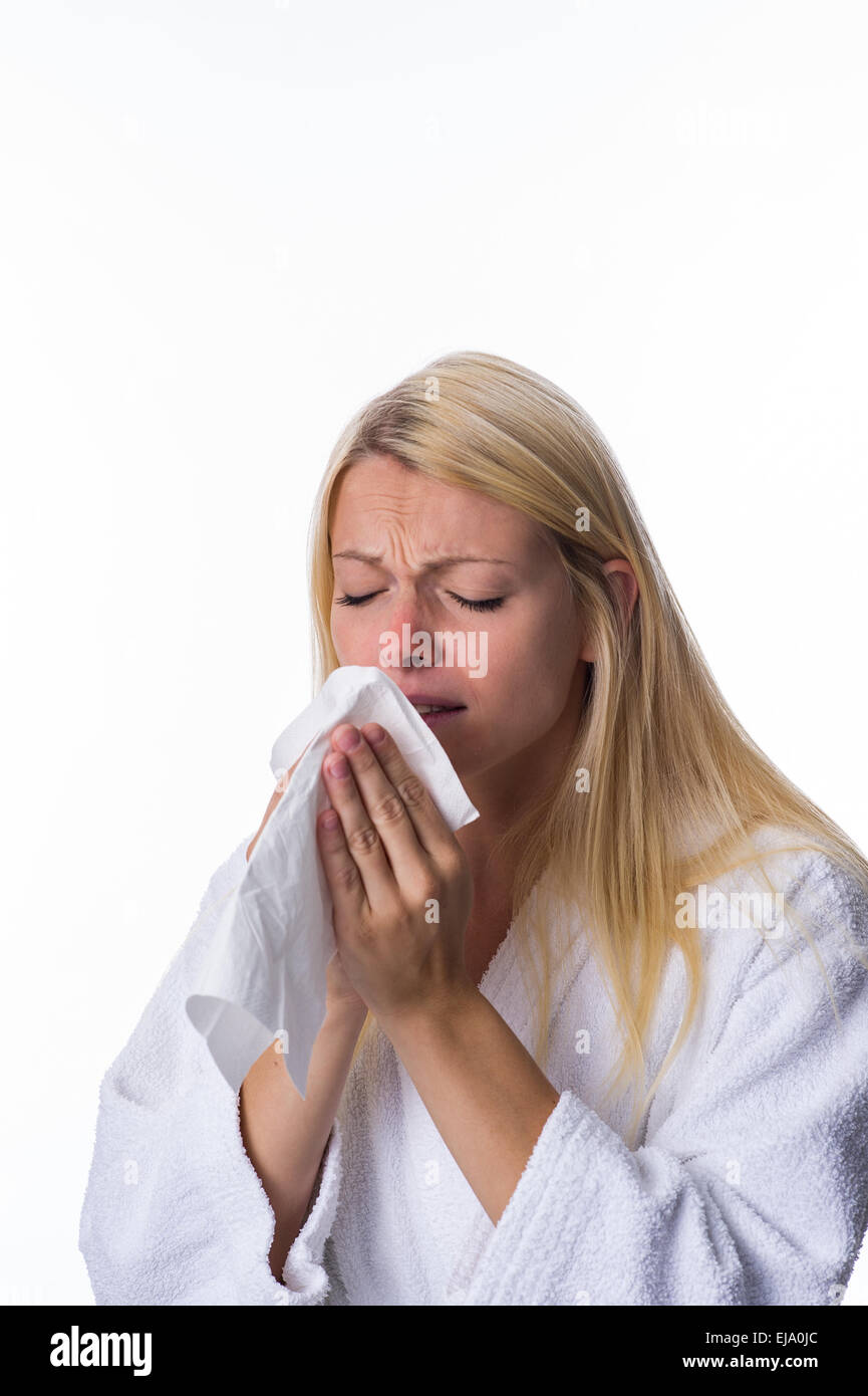Blonde sneezes into a handkerchief Stock Photo - Alamy