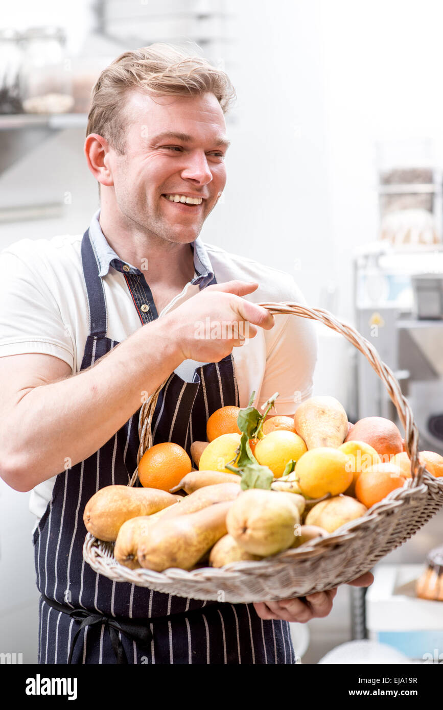 Man holding fruit basket hi-res stock photography and images - Alamy