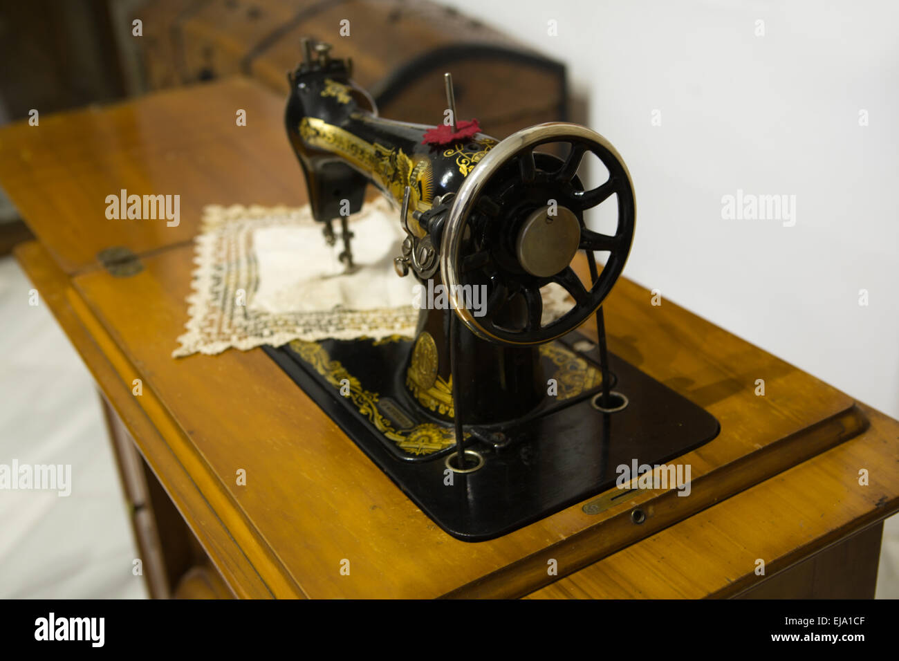 Antique mechanical treadle sewing machine black with gold ornaments ...